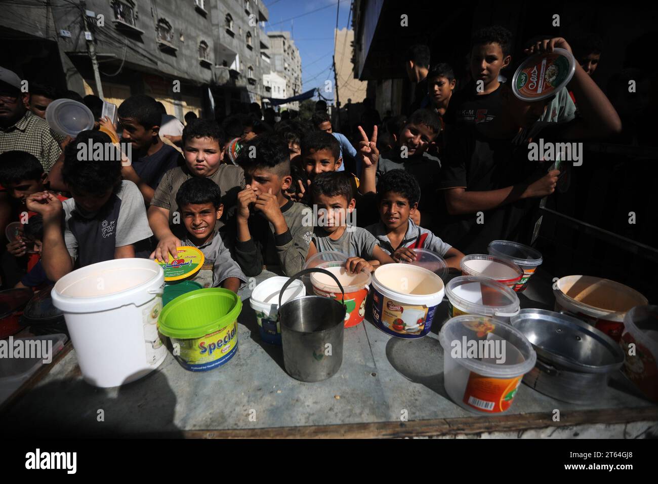 Gaza, Gaza. 08th Nov, 2023. Palestinian children queue to receive a ...