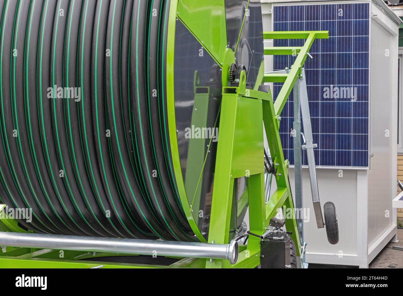Large Irrigation Hose Reel Trailer and Solar Panel Stock Photo - Alamy