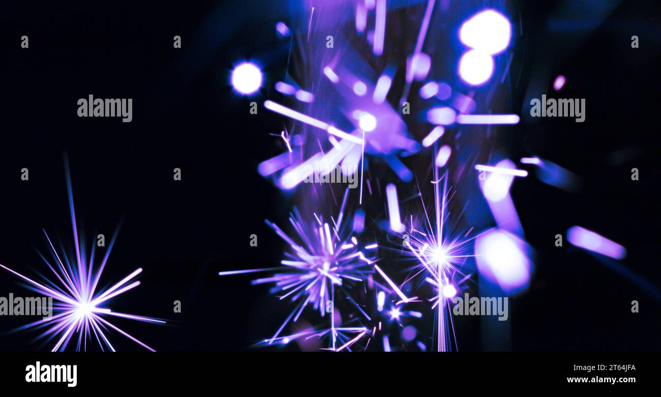Fireworks: close-up sparkler, purple, horizontal format Stock Photo - Alamy