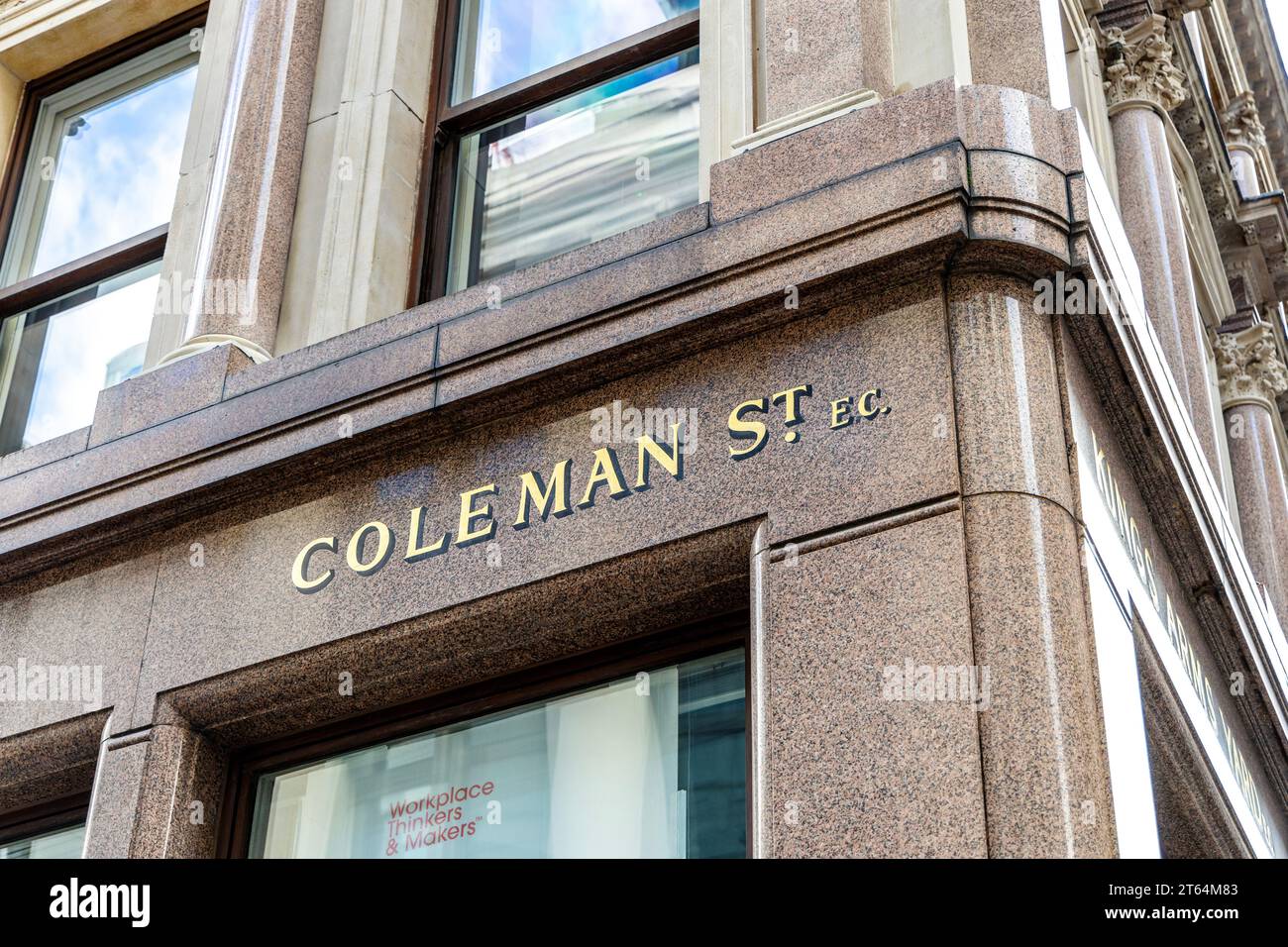 Sign for Comelan Street painted on a building facade in the Square Mile ...