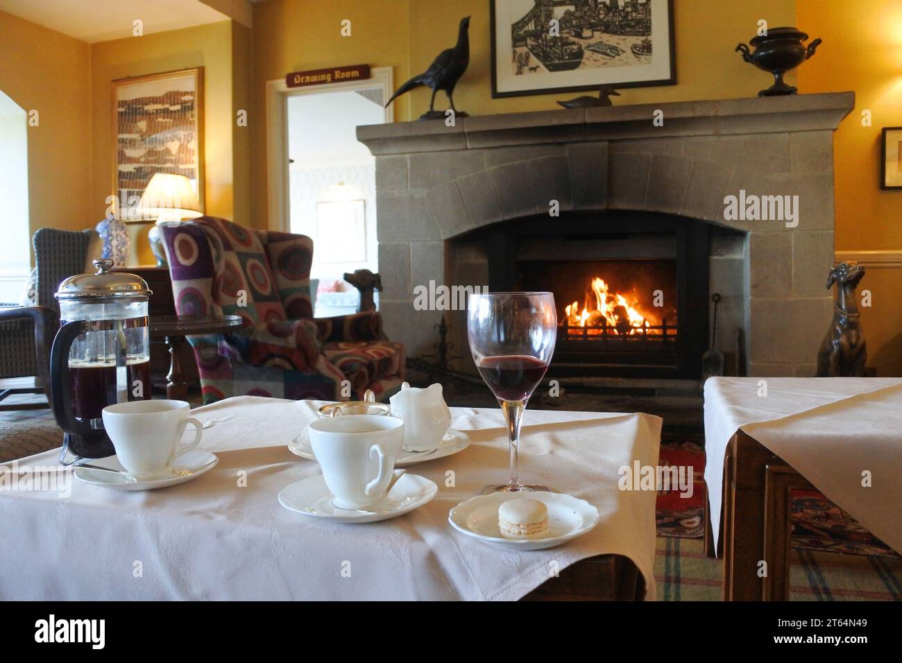 After dinner coffee in a restaurant lounge in front of a blazing fire ...