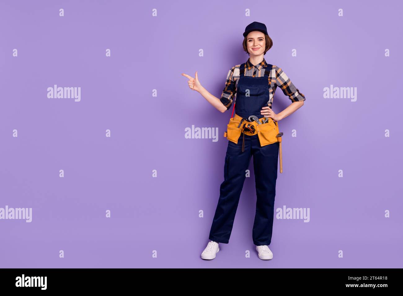 Full length body size photo of woman engineer wearing cap overall ...