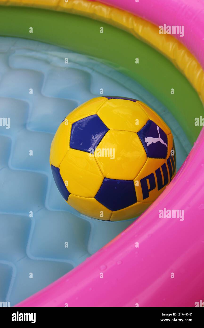 Little yellow ball in aт inflatable pool Stock Photo - Alamy