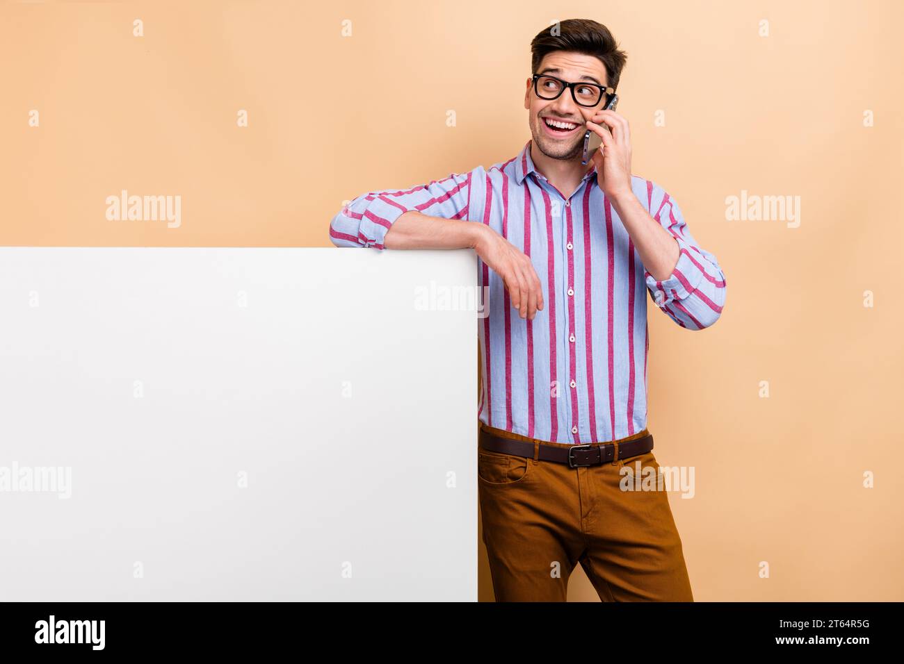 Photo of young guy interested talking with colleagues phone call ...