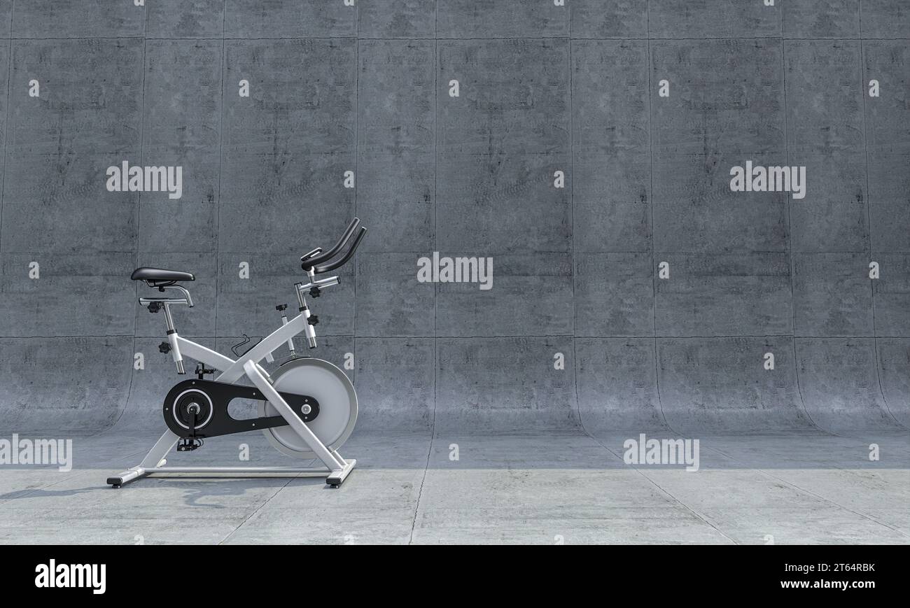 gym bike on modern concrete background Stock Photo - Alamy