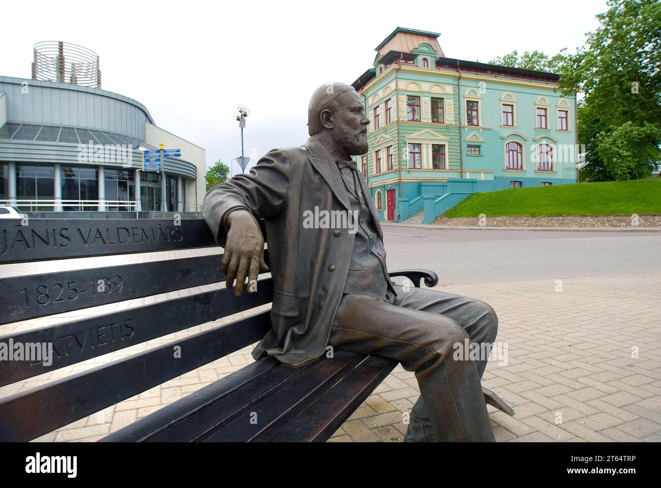 Statue of the poet Janis Valdemars, and the house of the Ventspils ...