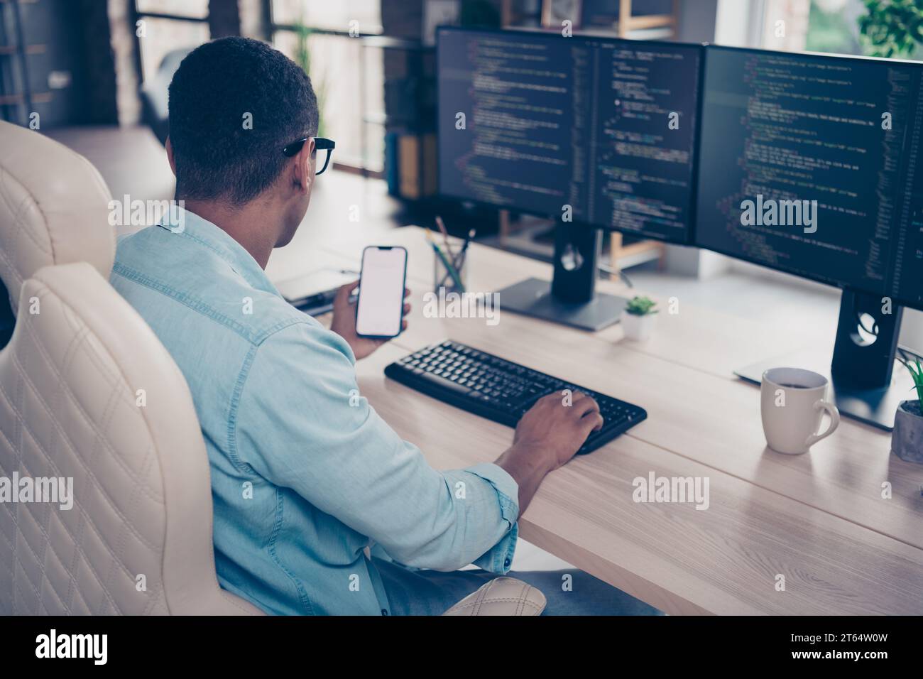 Side profile photo of expert young man programmer using smartphone ...