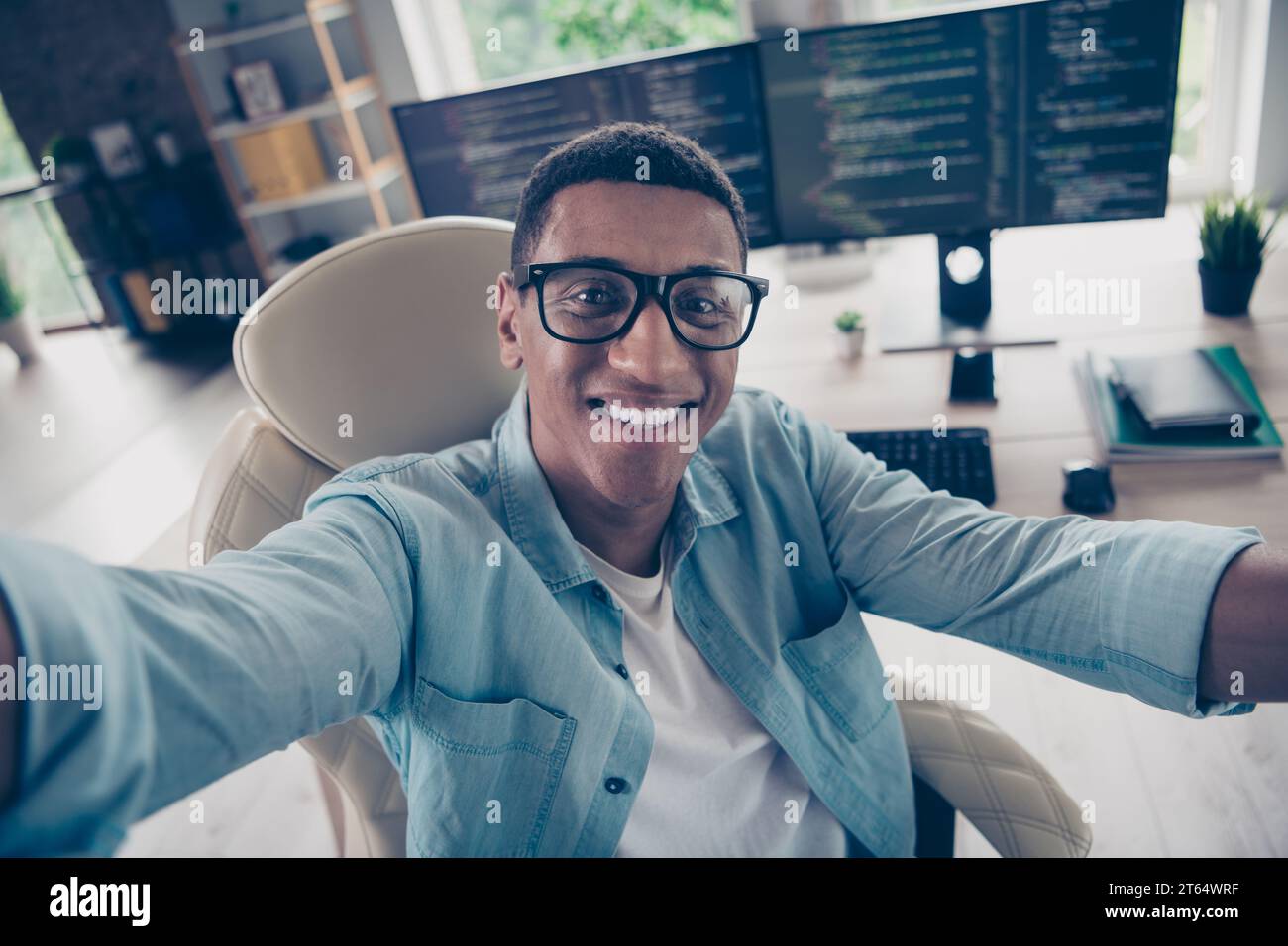 Self portrait of attractive student young positive guy working remotely ...