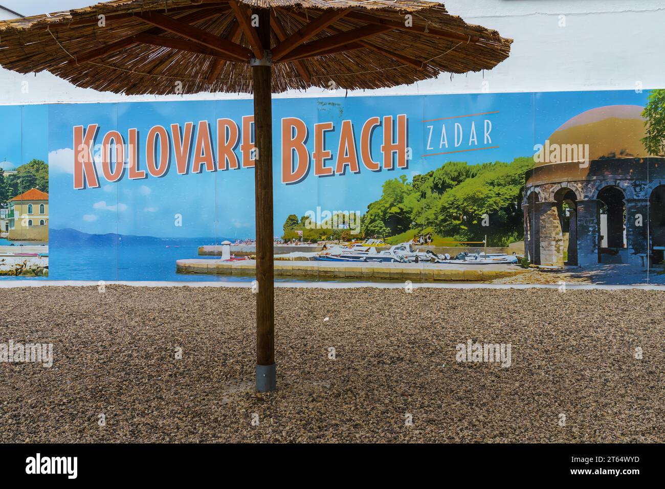 Kolovare Beach sign and straw umbrella in Zadar, Croatia. September 21 ...
