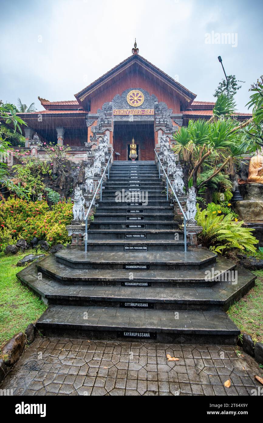A Buddhist temple in the evening in the rain. The Brahmavihara Arama ...