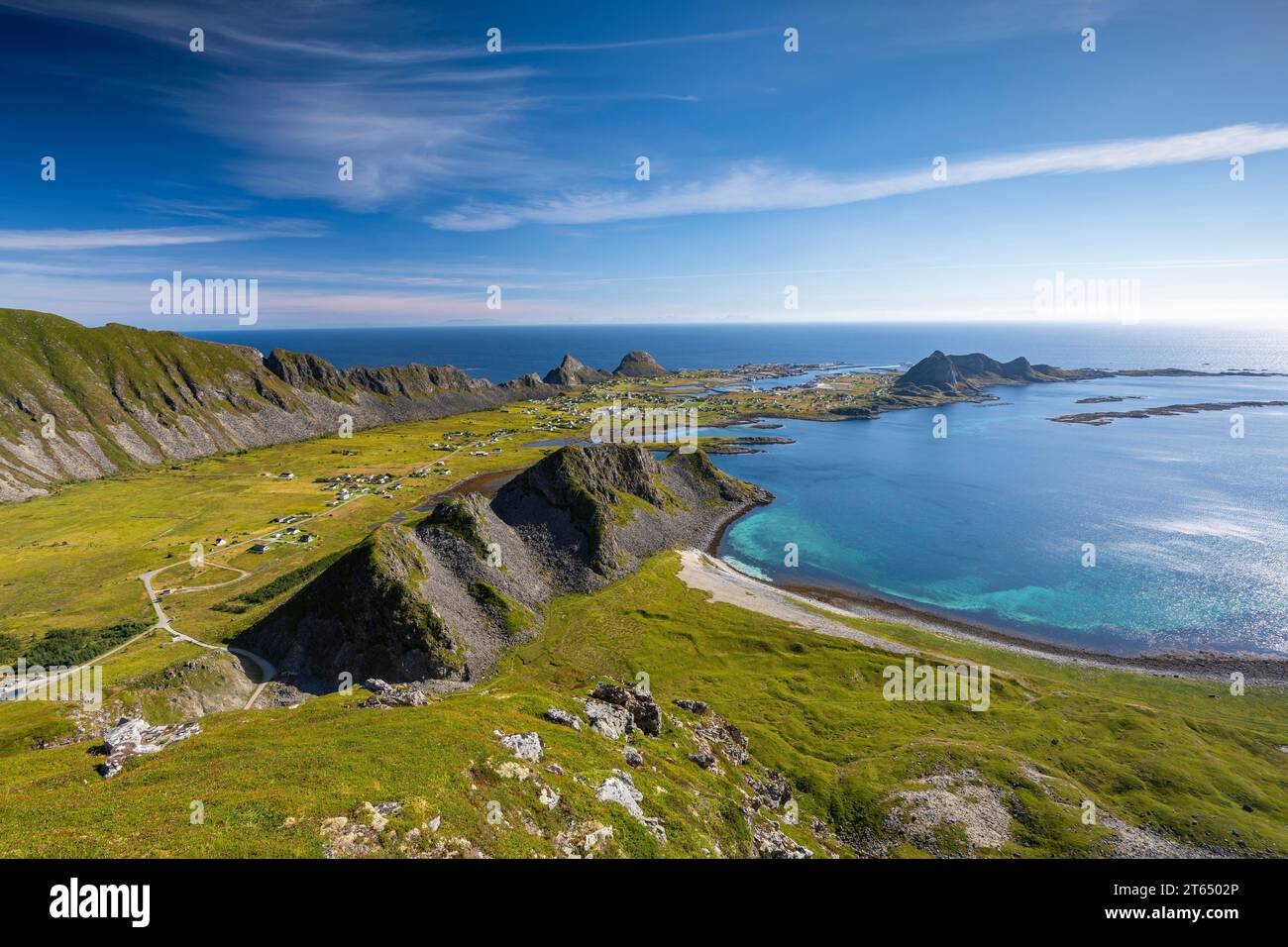 Coast and view of the village of Sorland on the island of Vaeroy ...