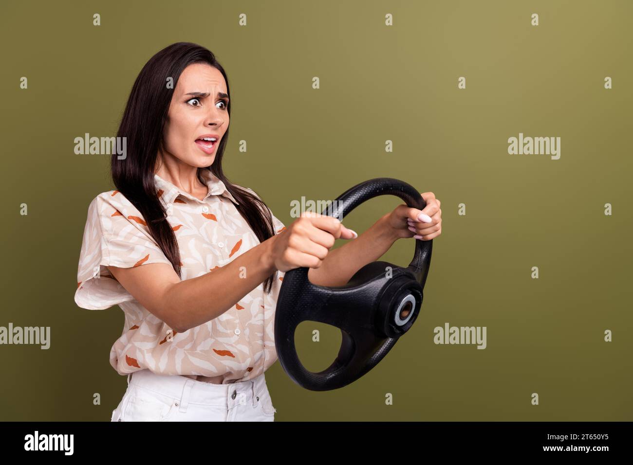 Photo of young confused funny woman hold steering wheel driving unknown ...