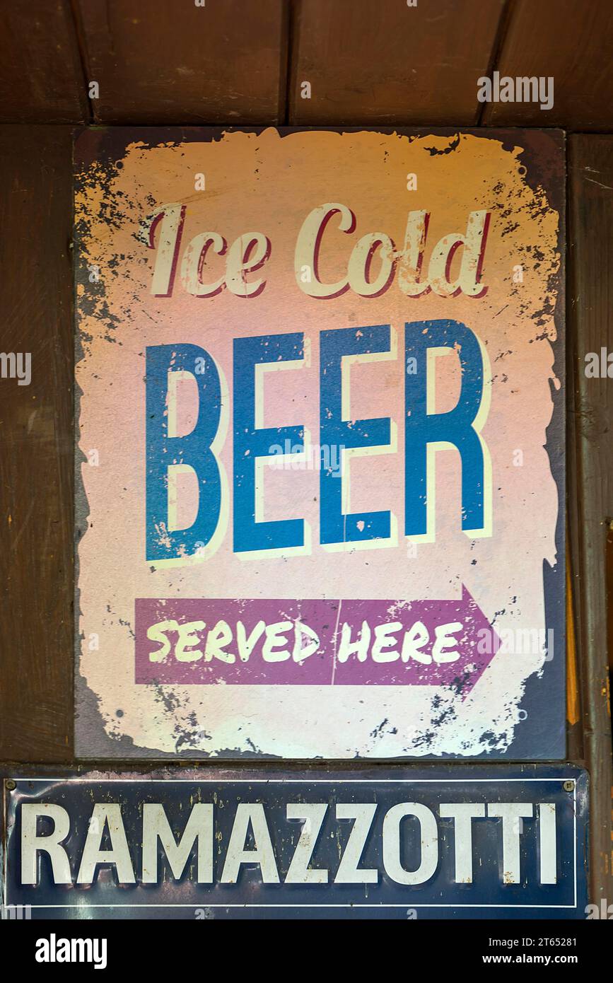 Beer advertising on a metal sign from the 1950s in a beer garden ...