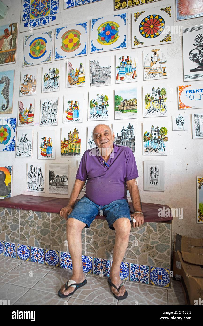 Tile painter in front of his tiles, Salvador, State of Bahia, Brazil ...