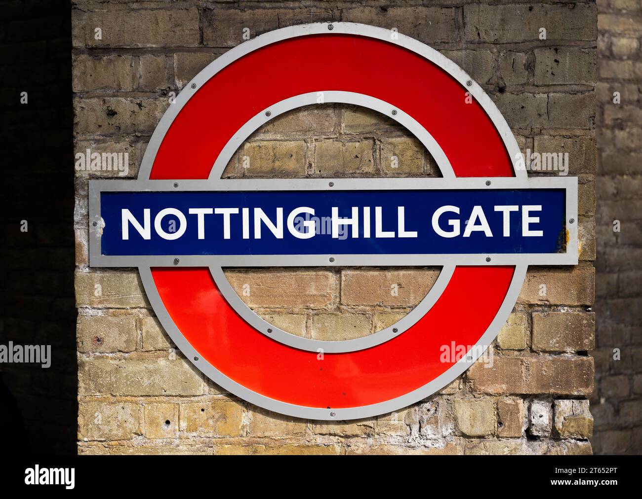Sign on brick wall, Notting Hill Gate underground station, SLondon ...