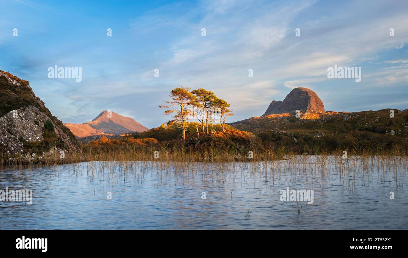 The last light of the day illuminates the mountains of Suilven and ...