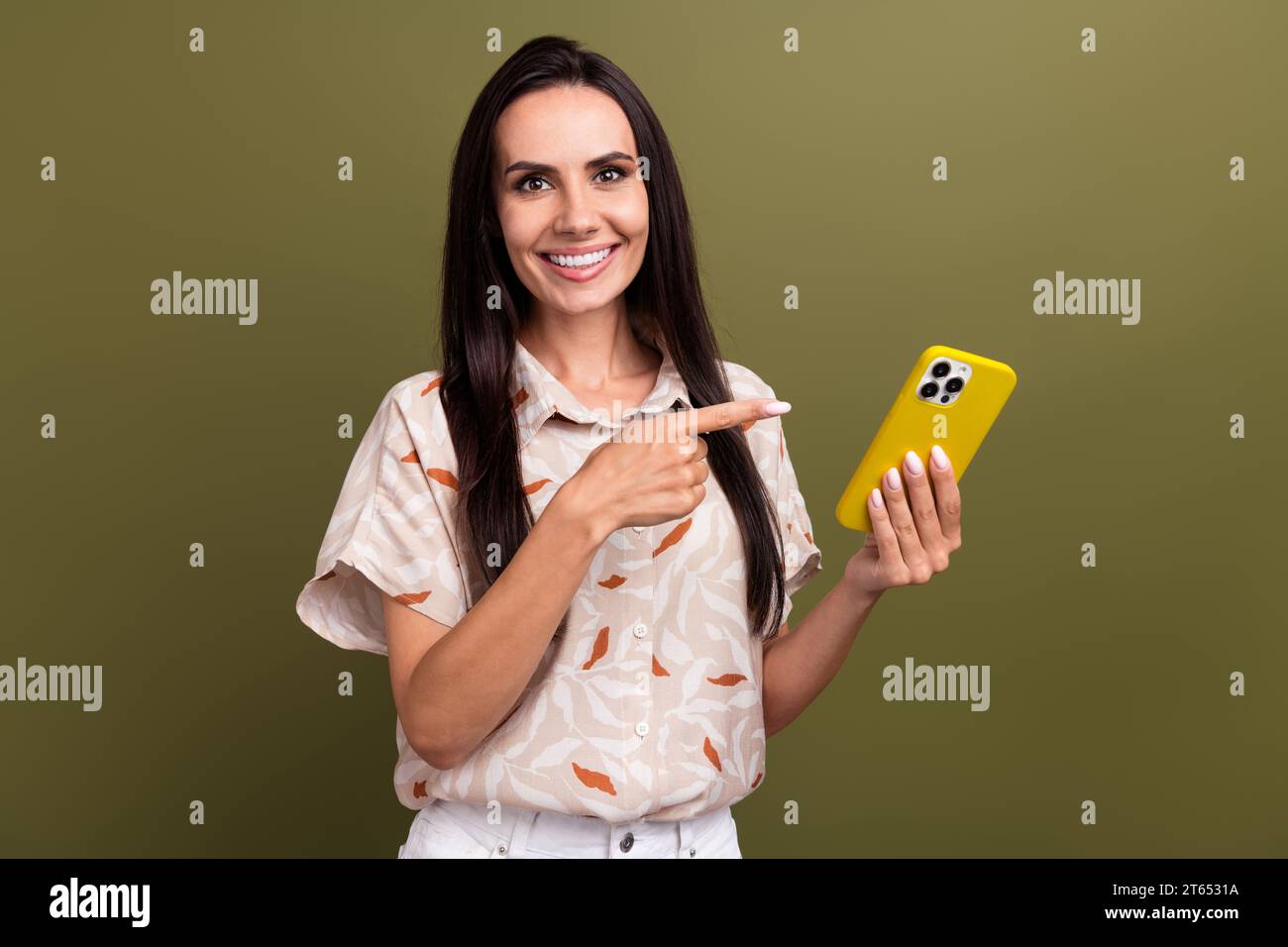 Photo of young woman promote her new smartphone directing finger show spotify premium free ...