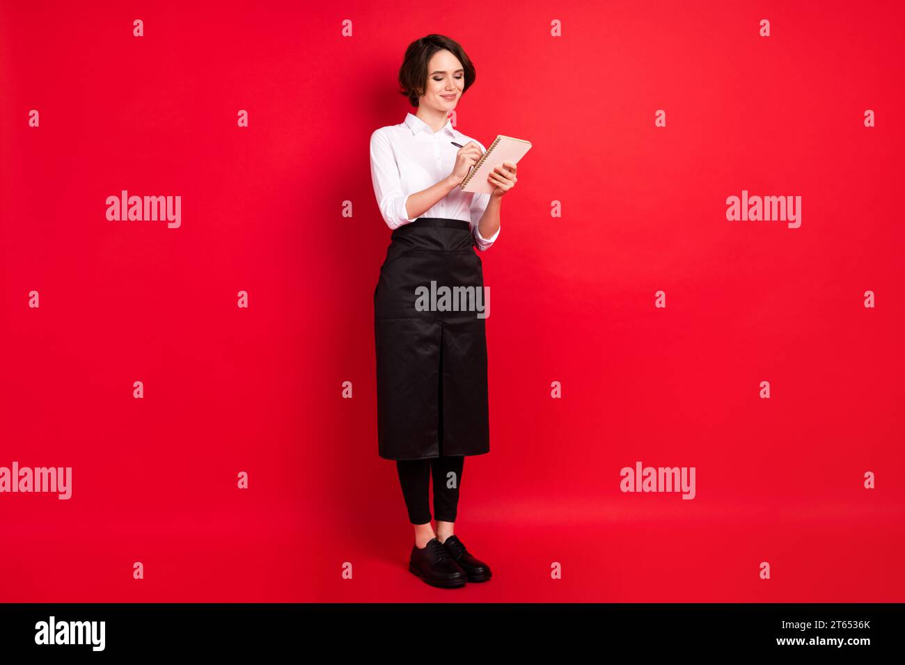 Full length photo of happy nice young woman hold note write order good ...