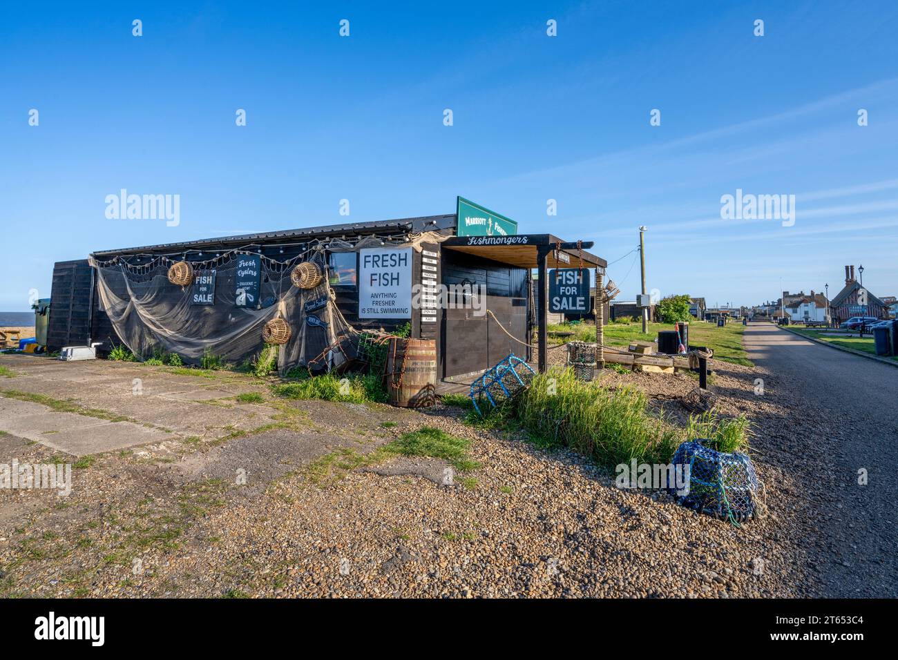 Traditonal fishermans shed selling fresh fish on the beach at the ...