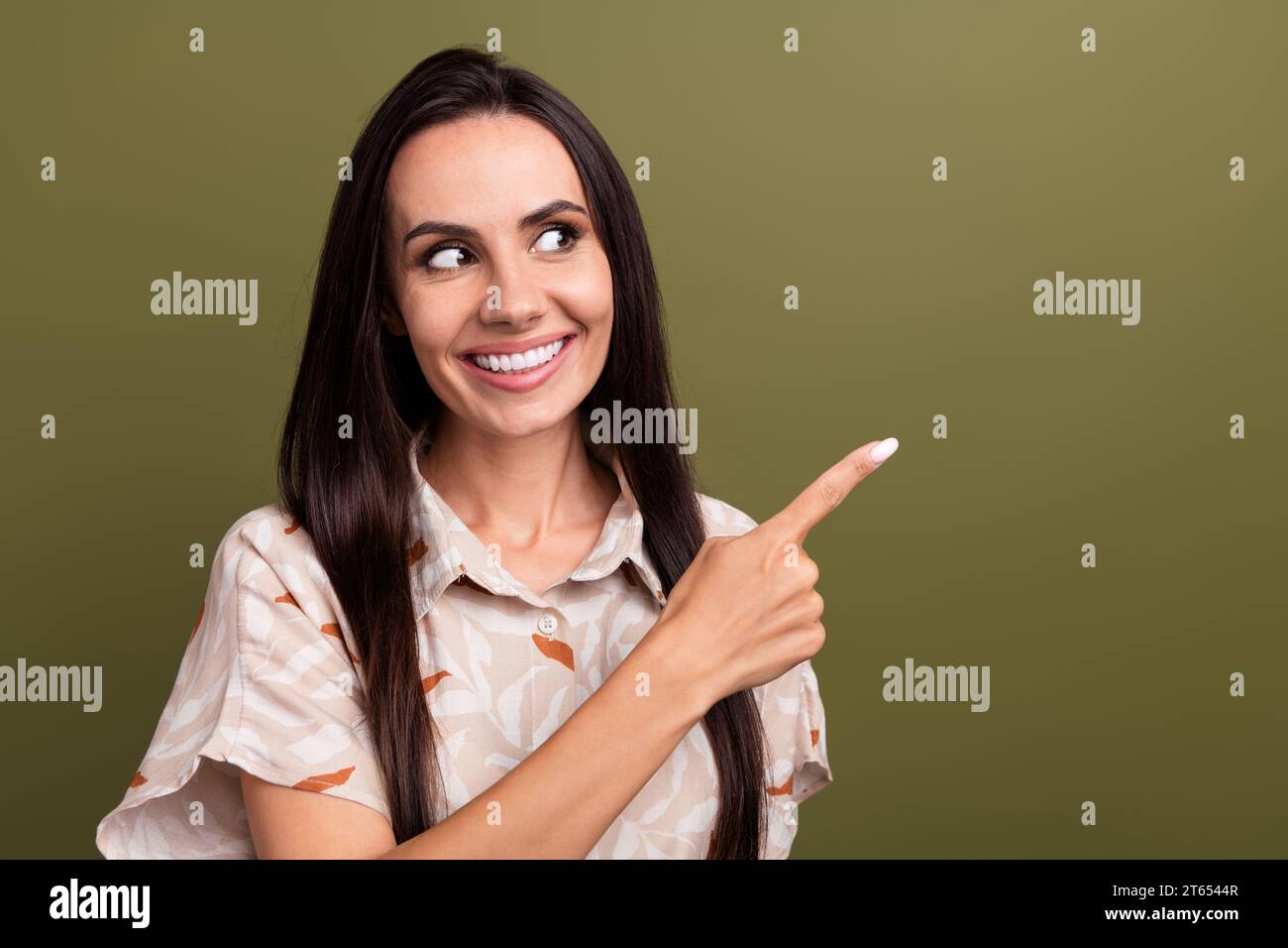 Photo of attractive young business lady pointing finger empty space ...