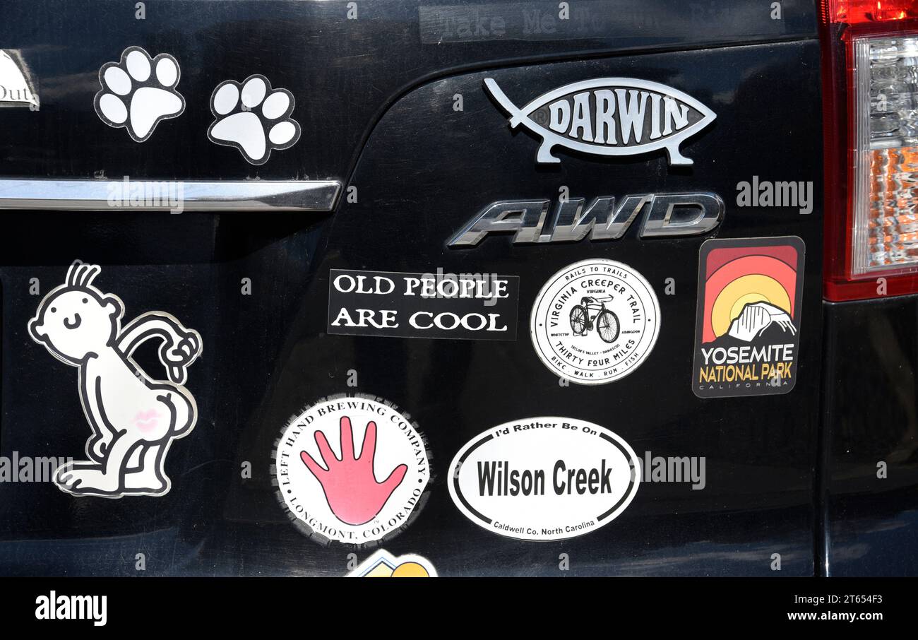 A variety of decals and stickers on the rear of a car in Virginia Stock ...