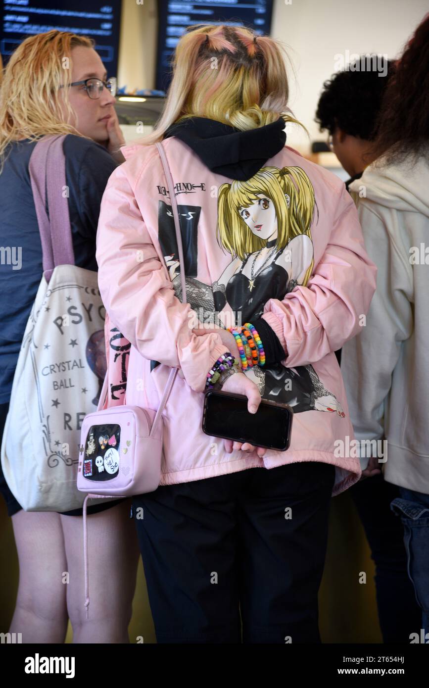 A teenage girl wearing a Death Note Misa jacket in a coffee shop in Blowing Rock, North Carolina ...