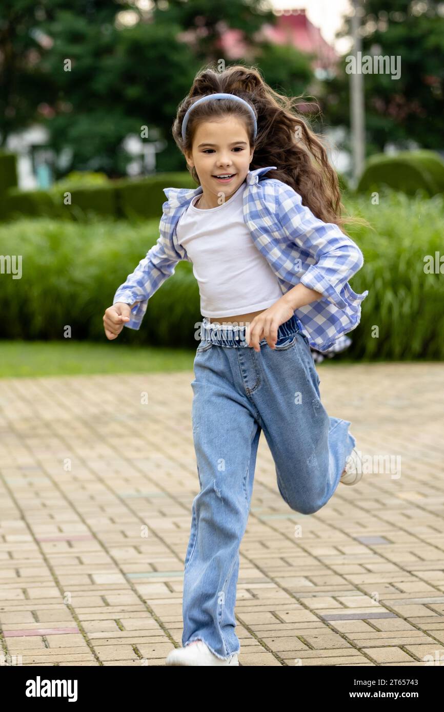 Kid running energetic happy hi-res stock photography and images - Alamy
