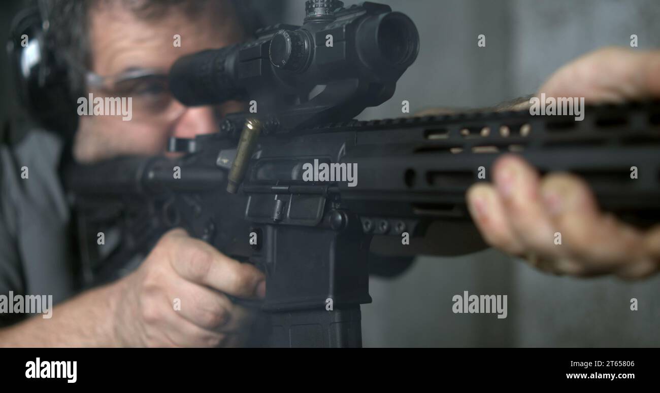 Firing an Assault rifle in super slow-motion 800 fps. Person shooting ...