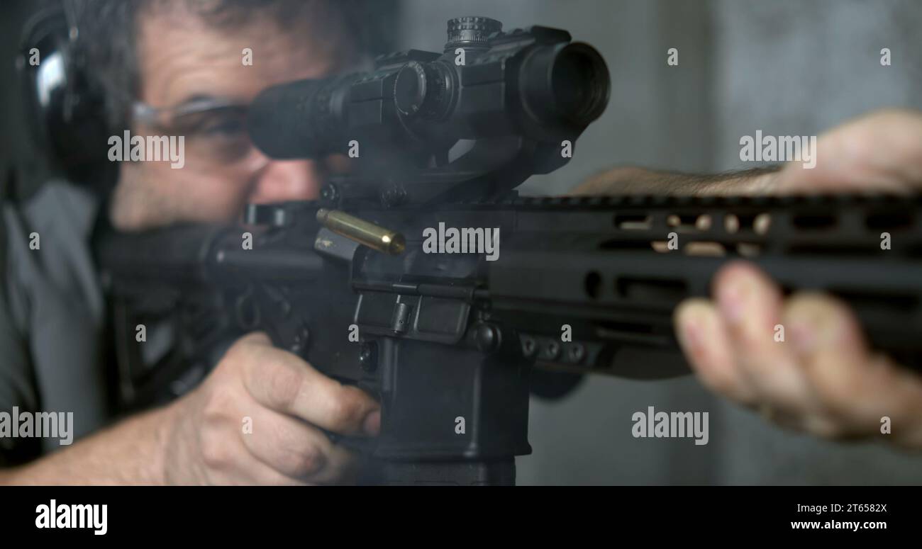 Firing an Assault rifle in super slow-motion 800 fps. Person shooting ...