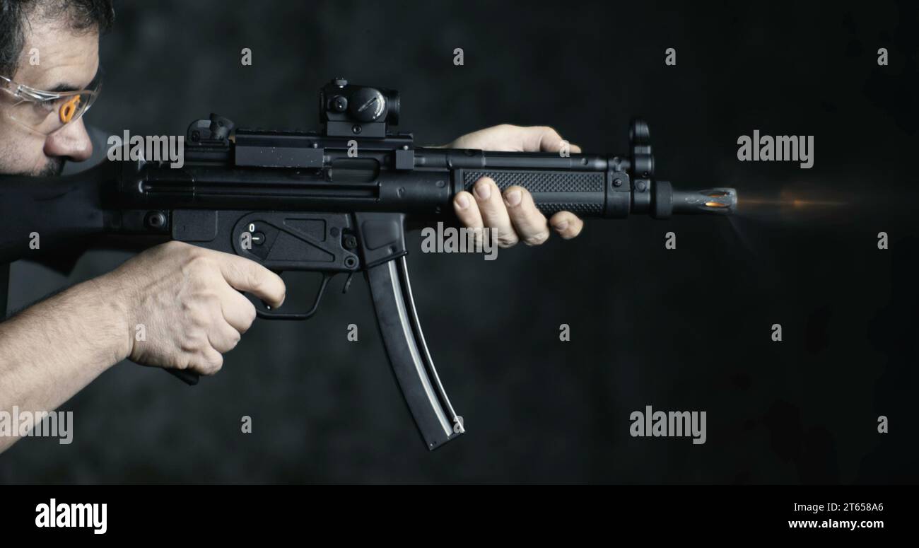 High-Speed Shooting with HK SP5K Assault Rifle, Side Perspective of ...