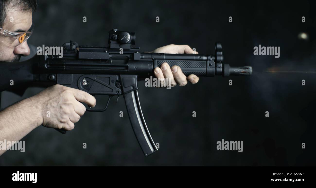 High-Speed Shooting with HK SP5K Assault Rifle, Side Perspective of ...