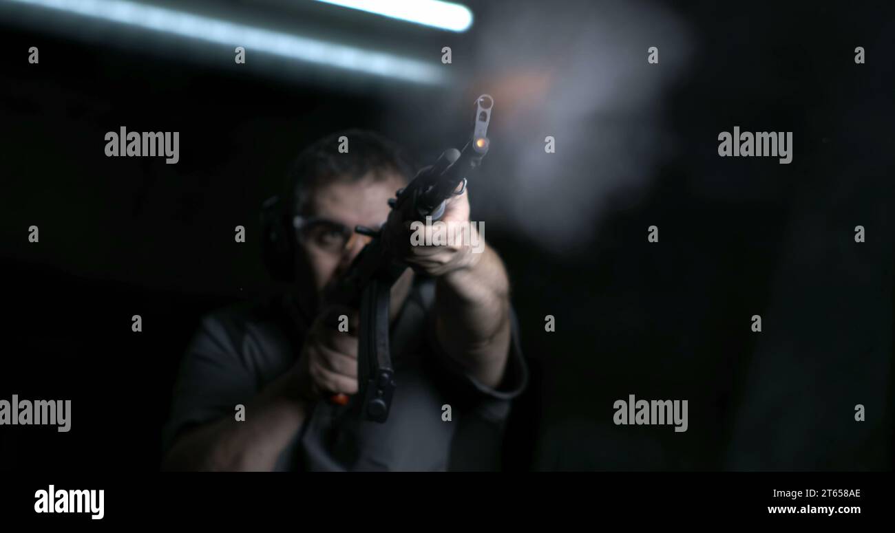 Man aiming and firing with weapon in super slow-motion 800 fps. Person ...