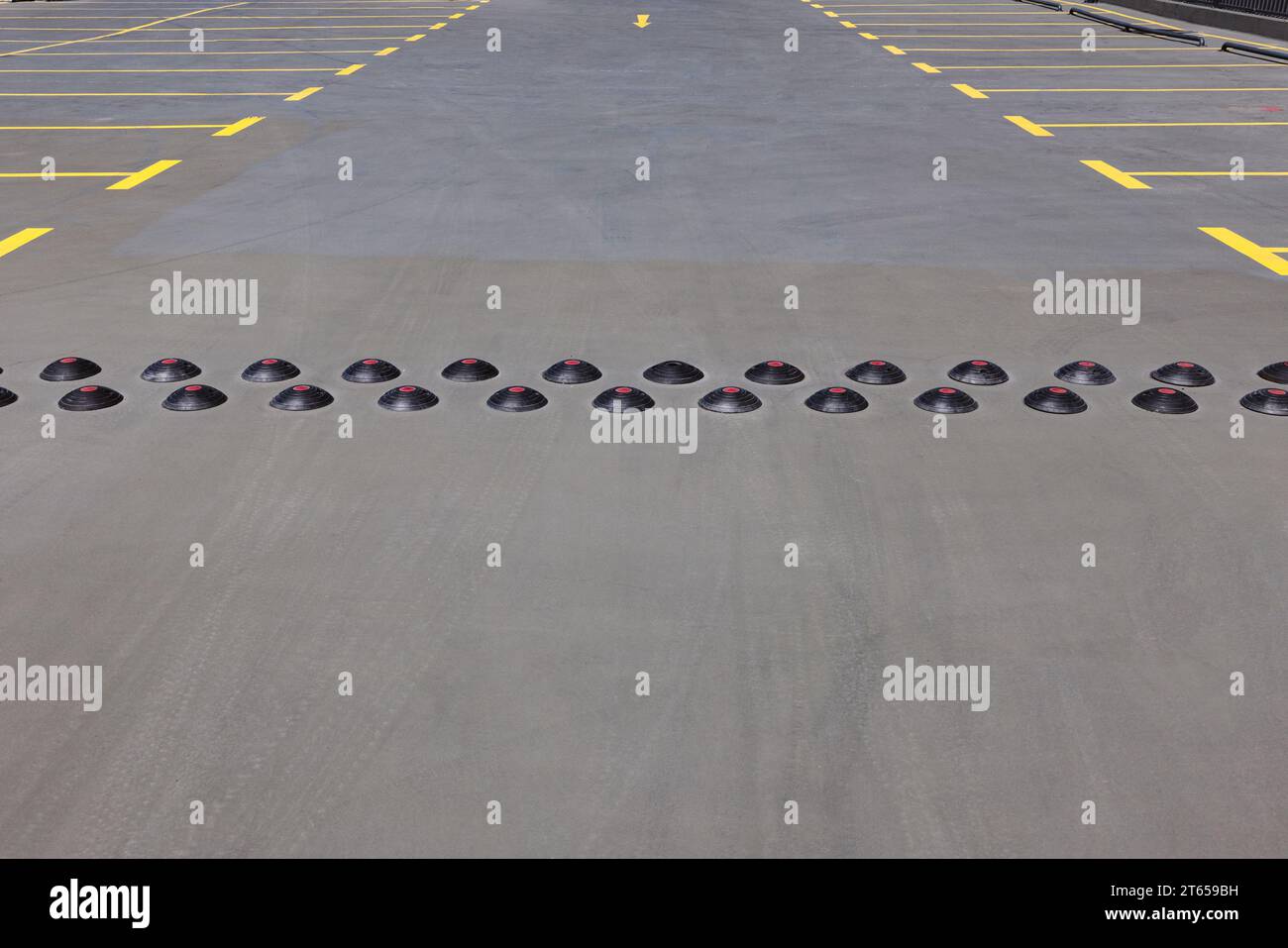 Shot of a line with speed bumps Stock Photo - Alamy