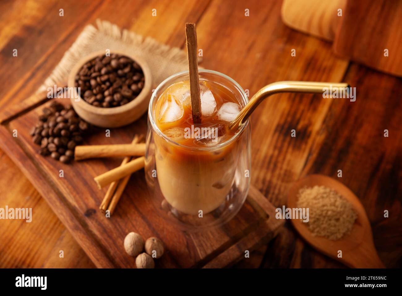 Iced coffee served in a double-walled glass cup and metal straw, a cold ...