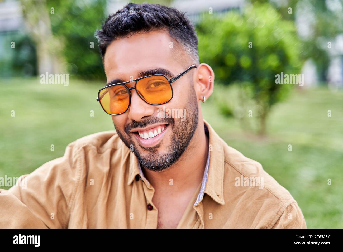 Man smile portrait orange hi-res stock photography and images - Alamy