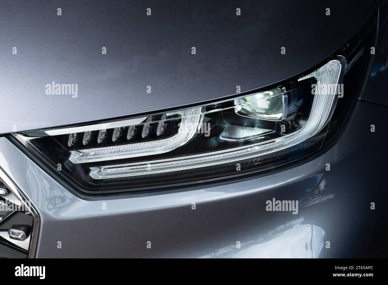 Led light car technology theme. Modern headlight on new gray car Stock ...