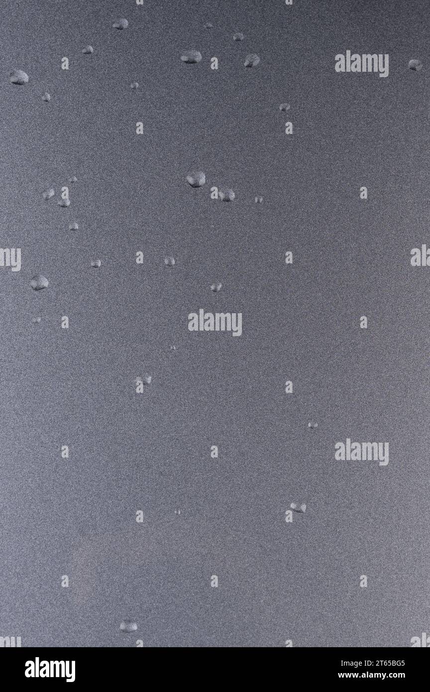 Rain dew on car gray color metal background close up view Stock Photo ...