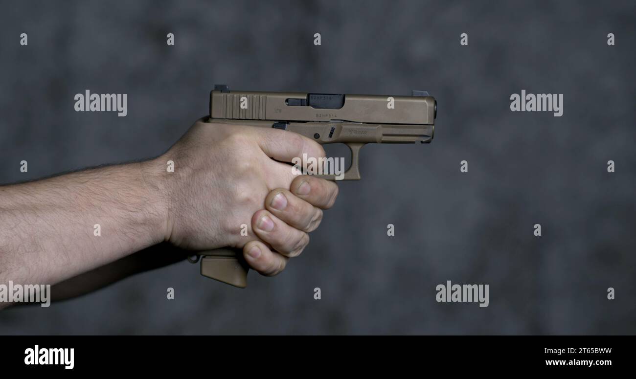 Pistol shooting slow motion close hi-res stock photography and images ...