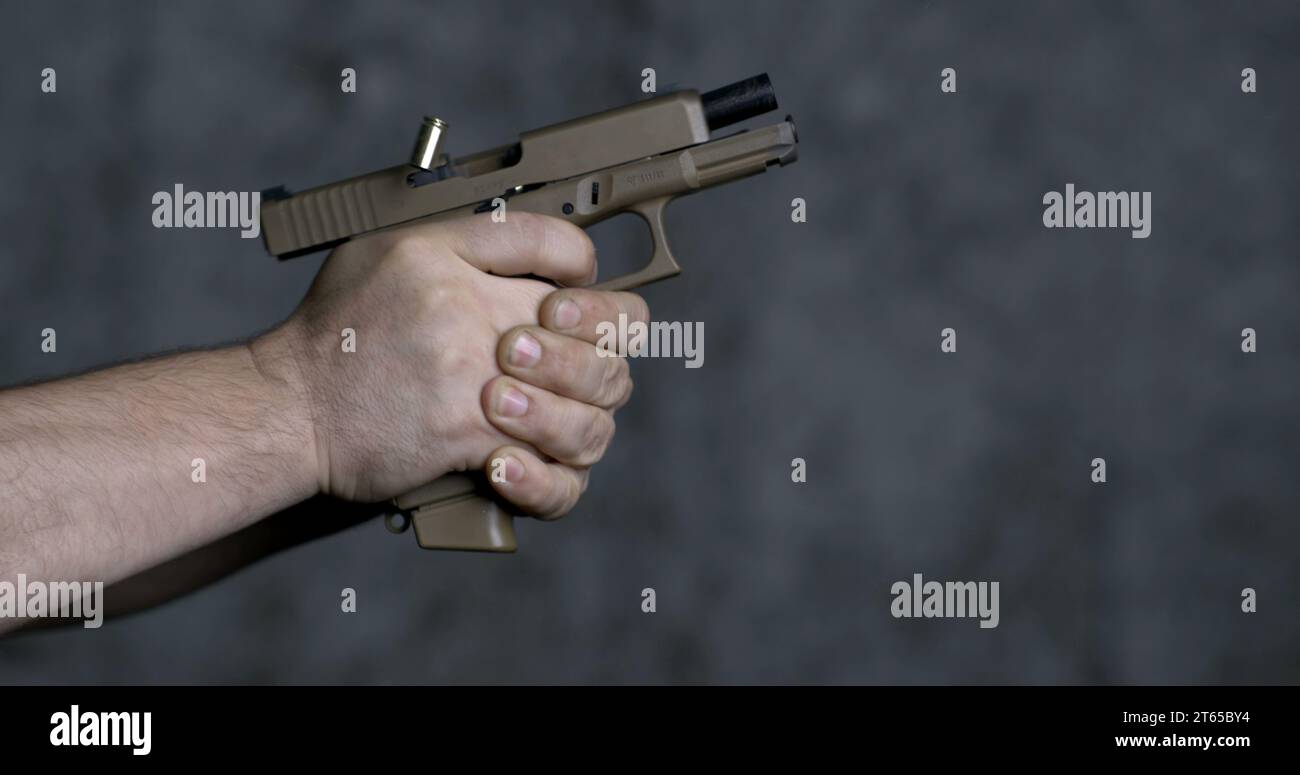 Shooting with a Sig Sauer P320 9mm close-up pistol in super slow-motion ...