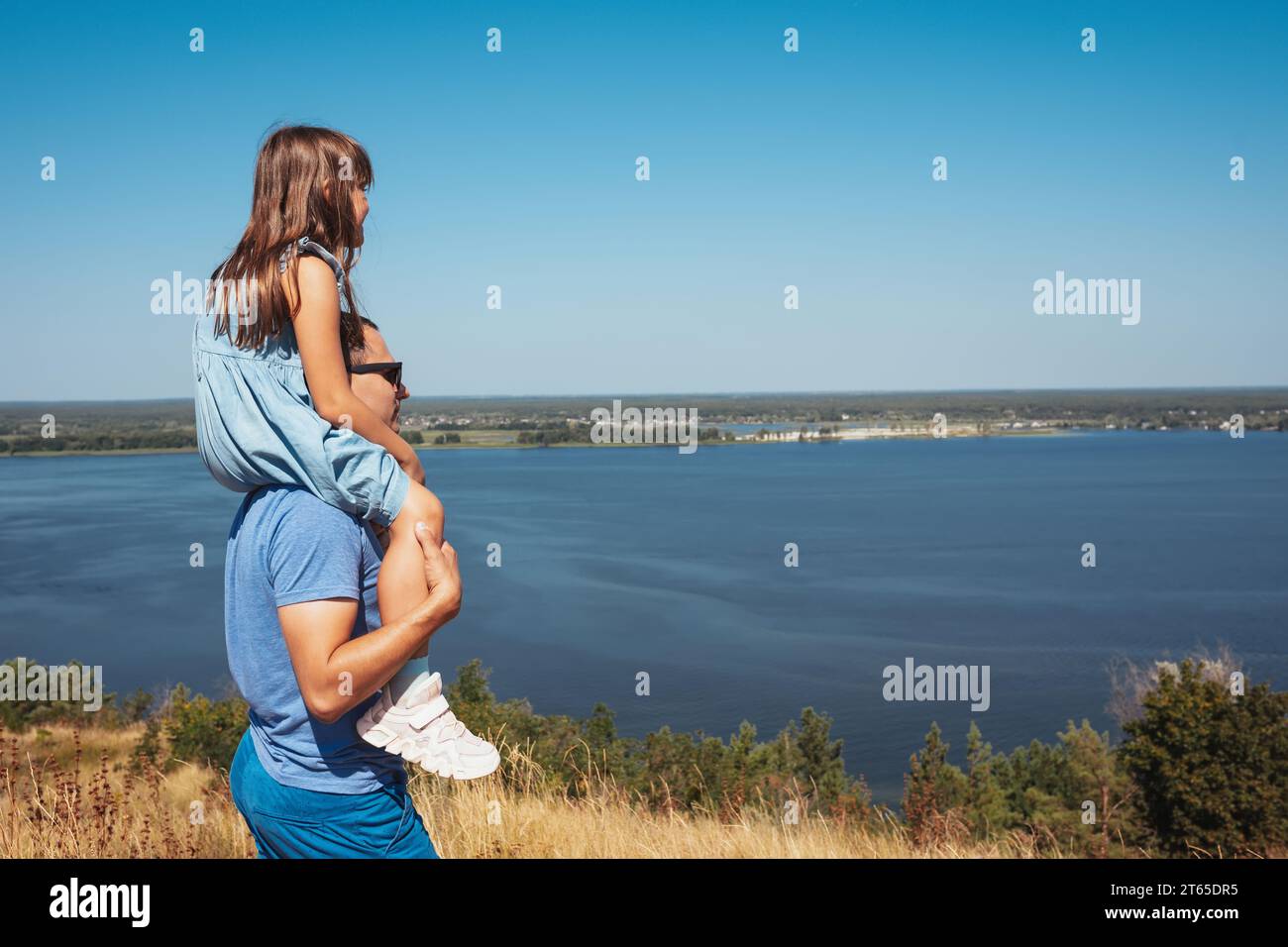 Happy father with his daughter having fun and playing in nature. The ...