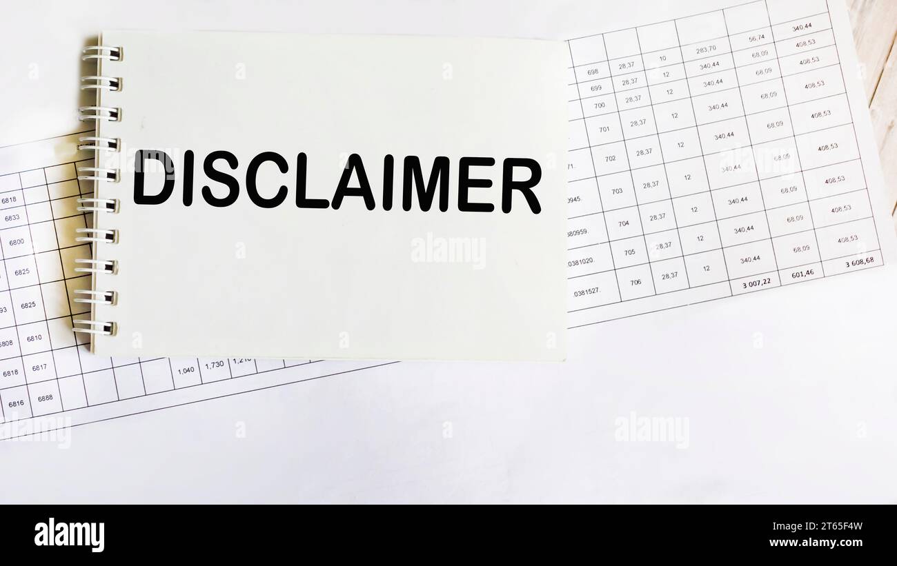 Notepad with disclaimer text lying on documents and white background ...