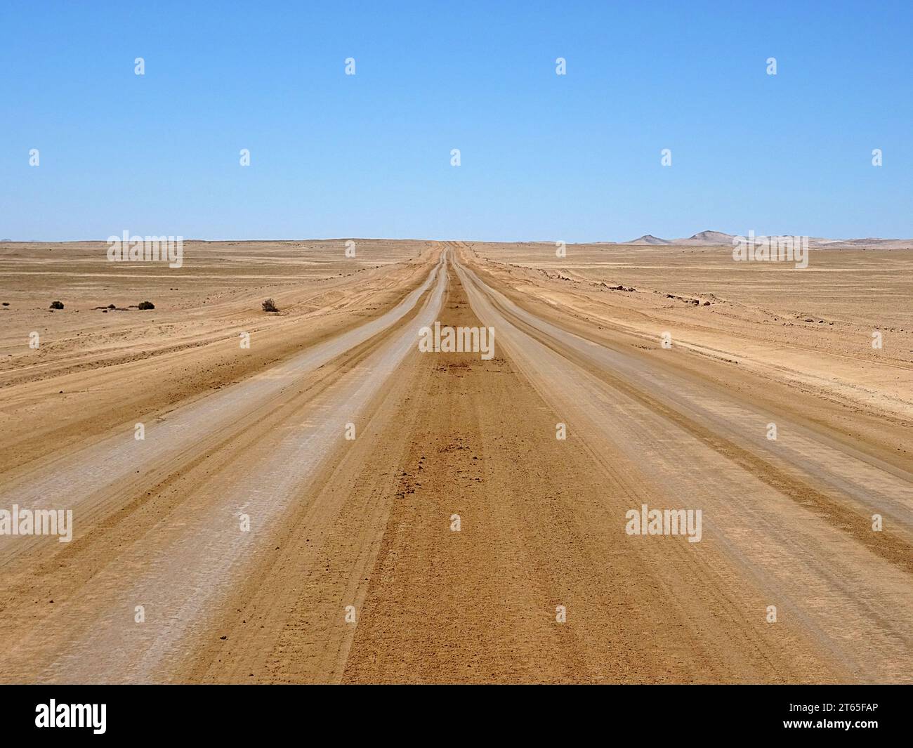 Empty desert road in the Namib-Nauluft park of Namibia, blue sky and no ...
