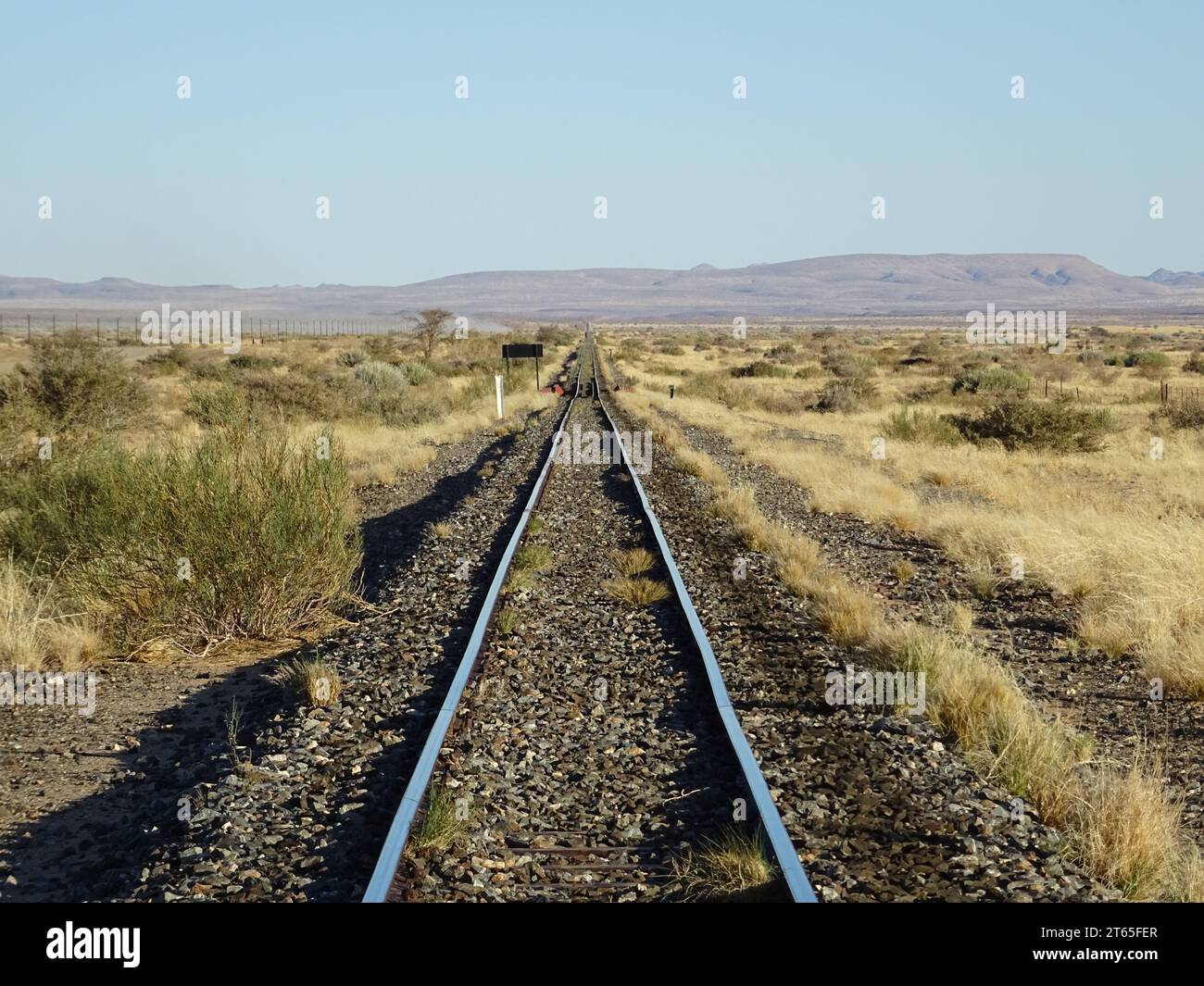 Lone straight railway in Namibia Stock Photo - Alamy