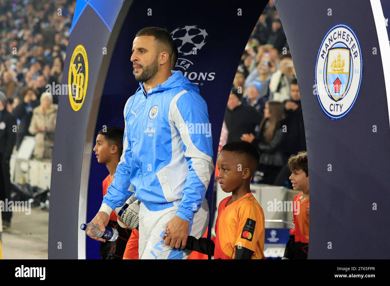 Kyle Walker #2 of Manchester City leads the team out ahead of the UEFA ...
