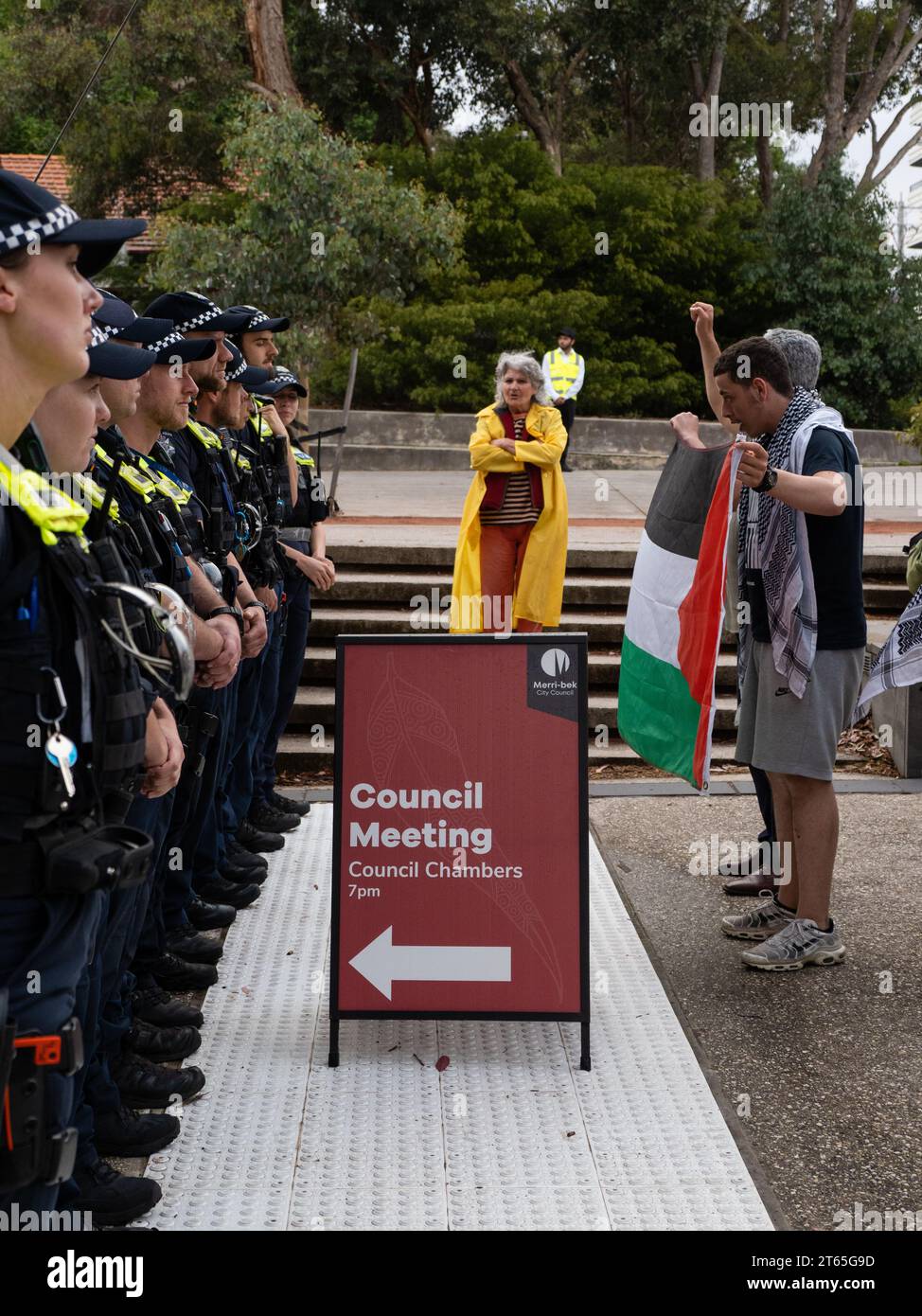 Protesters arrive at a police line outside the entrance of Coburg Town ...