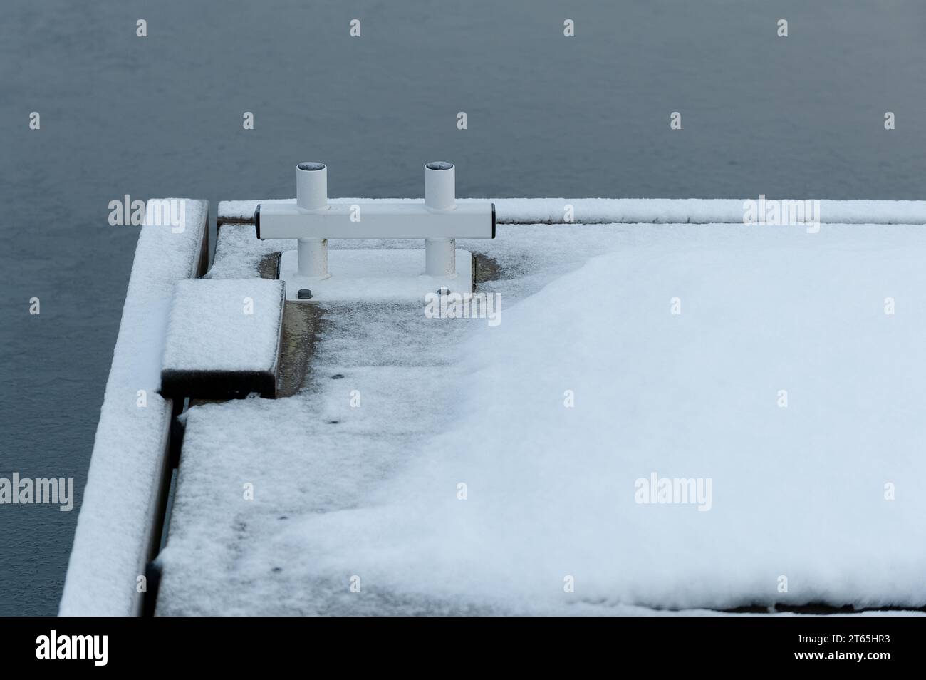 snow-covered quayside with construction for mooring boats Stock Photo ...