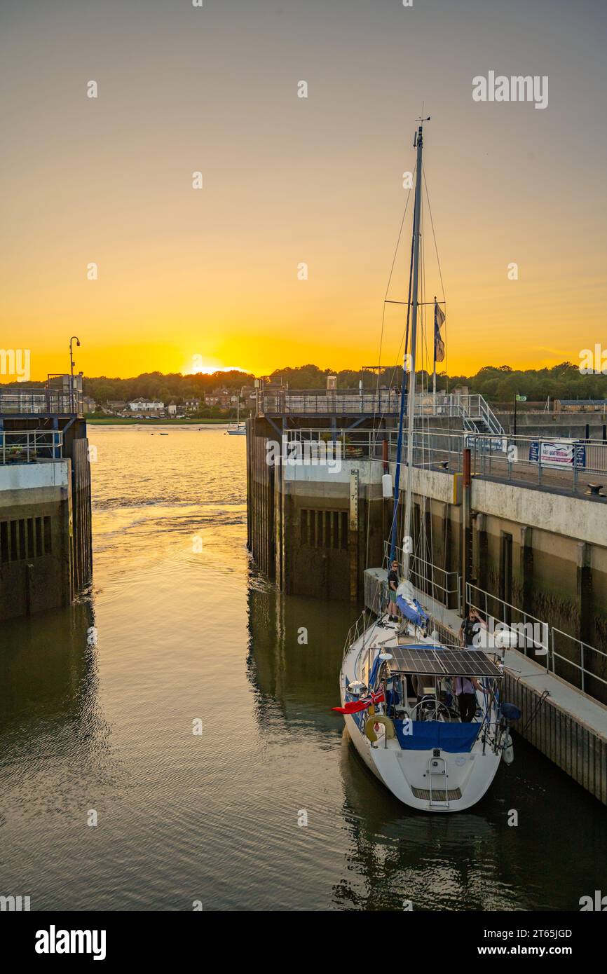 Yacht in the lock from Chatham Maritime Marina to the river Medway at ...