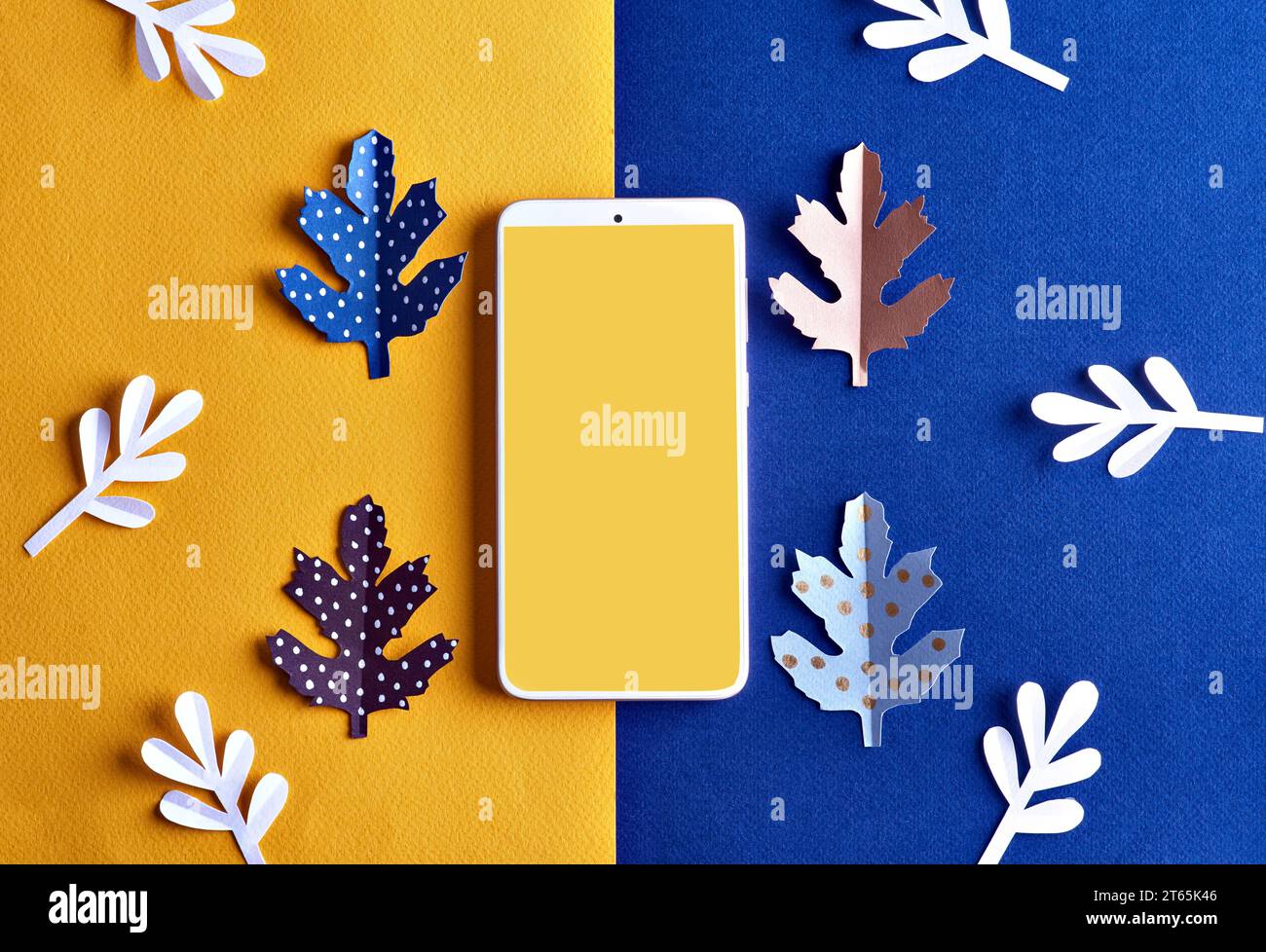 White mobile phone with empty black space for text in the middle lie on ...