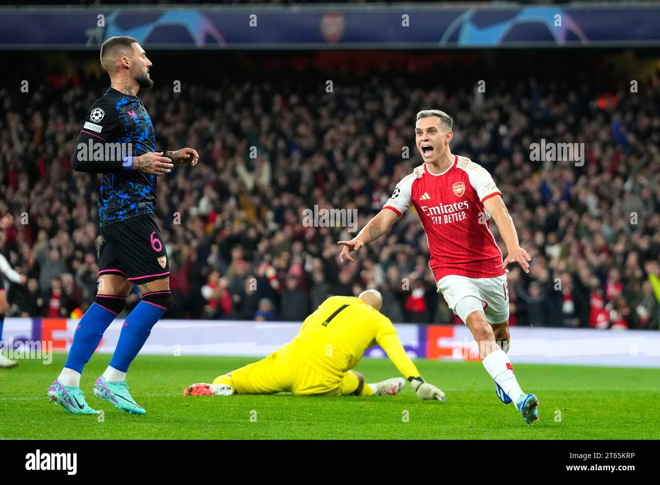Arsenal's Leandro Trossard, right, celebrates after scoring the opening ...
