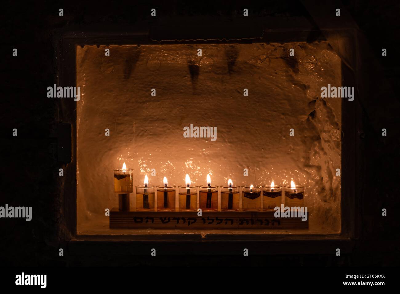 Candles burning on golden menorah hi-res stock photography and images ...